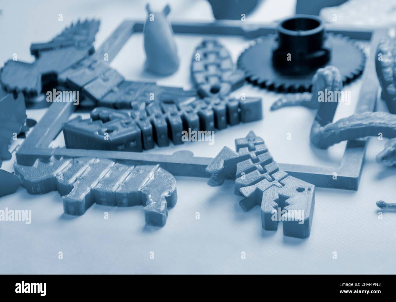 Models printed by 3d printer. Bright colorful objects printed on a 3d ...