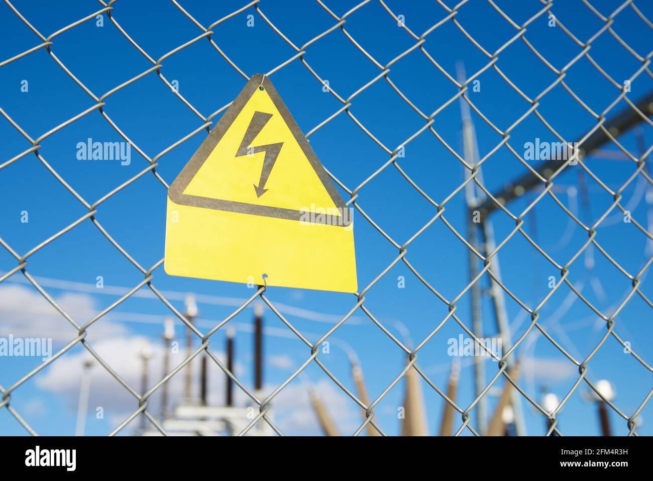 Electrical hazard sign placed on a metal fence Stock Photo - Alamy
