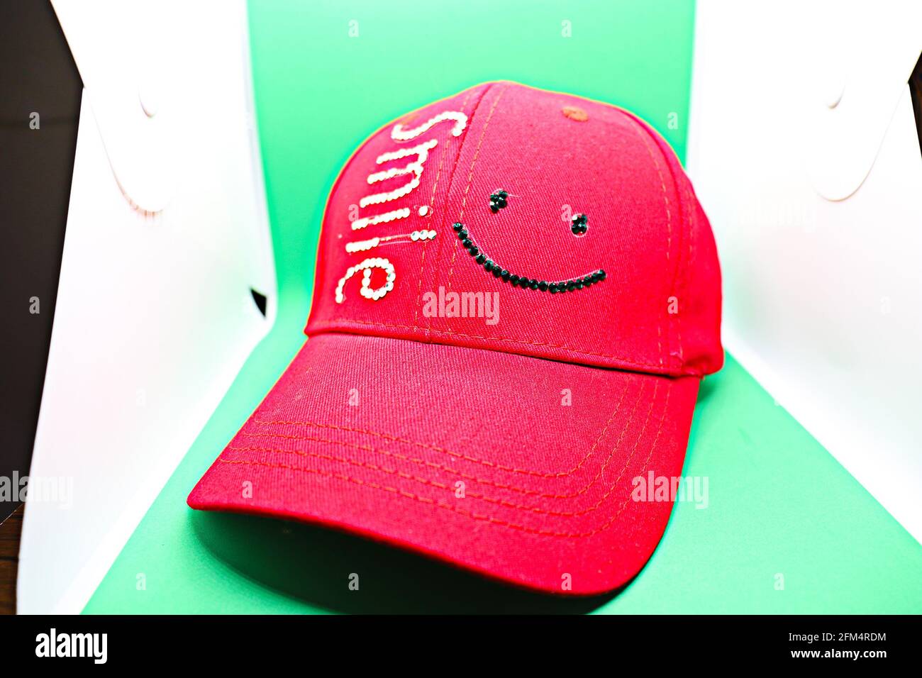 red cap with smile Stock Photo - Alamy