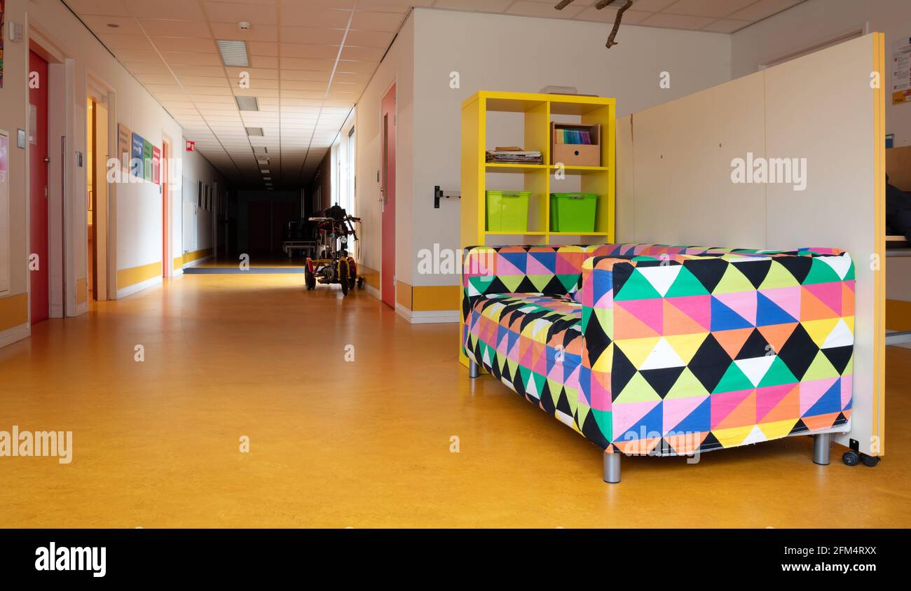 Waiting area in a school, colorful couch Stock Photo - Alamy