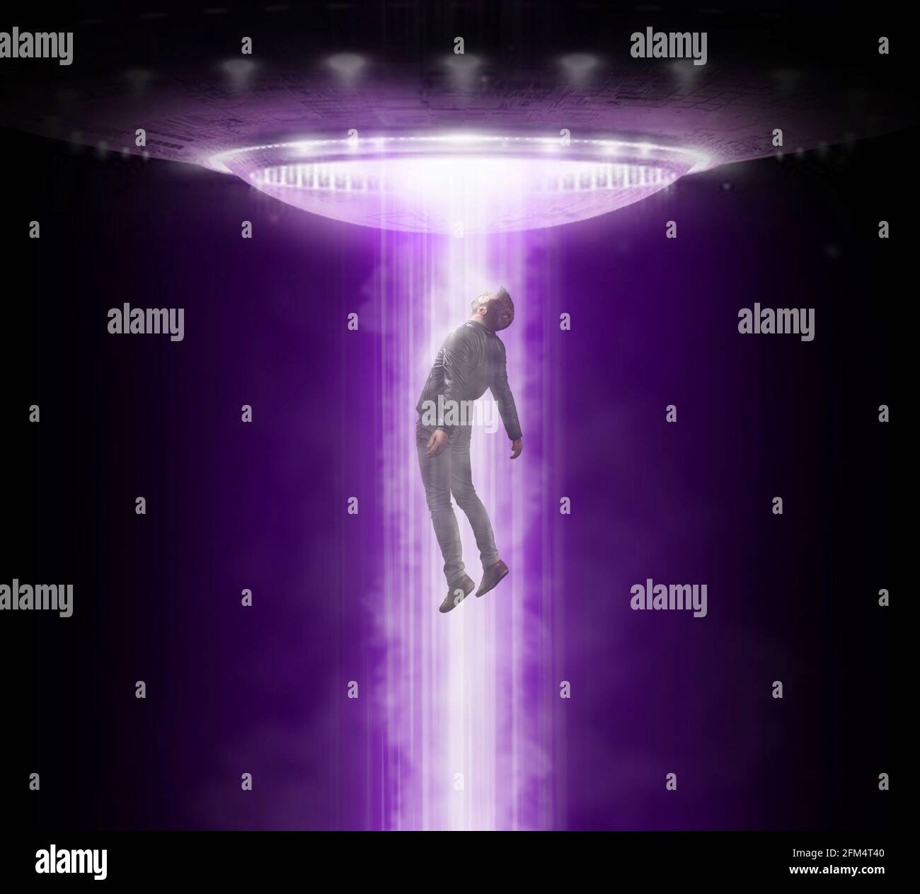 Man being abducted by UFO - alien abduction concept Stock Photo - Alamy