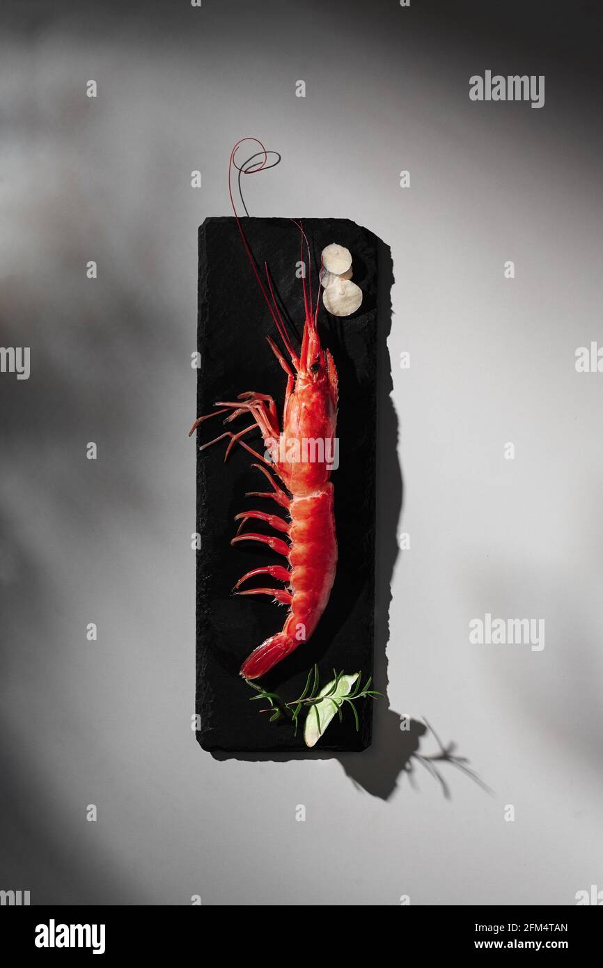 Cooked red shrimp with condiments on grey background with shadow Stock ...