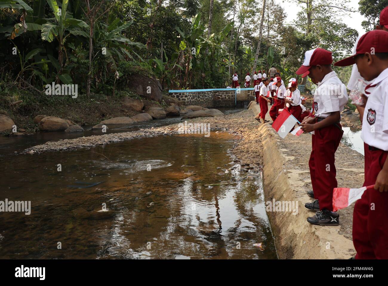 Group of elementary school students playing by the river Stock Photo ...
