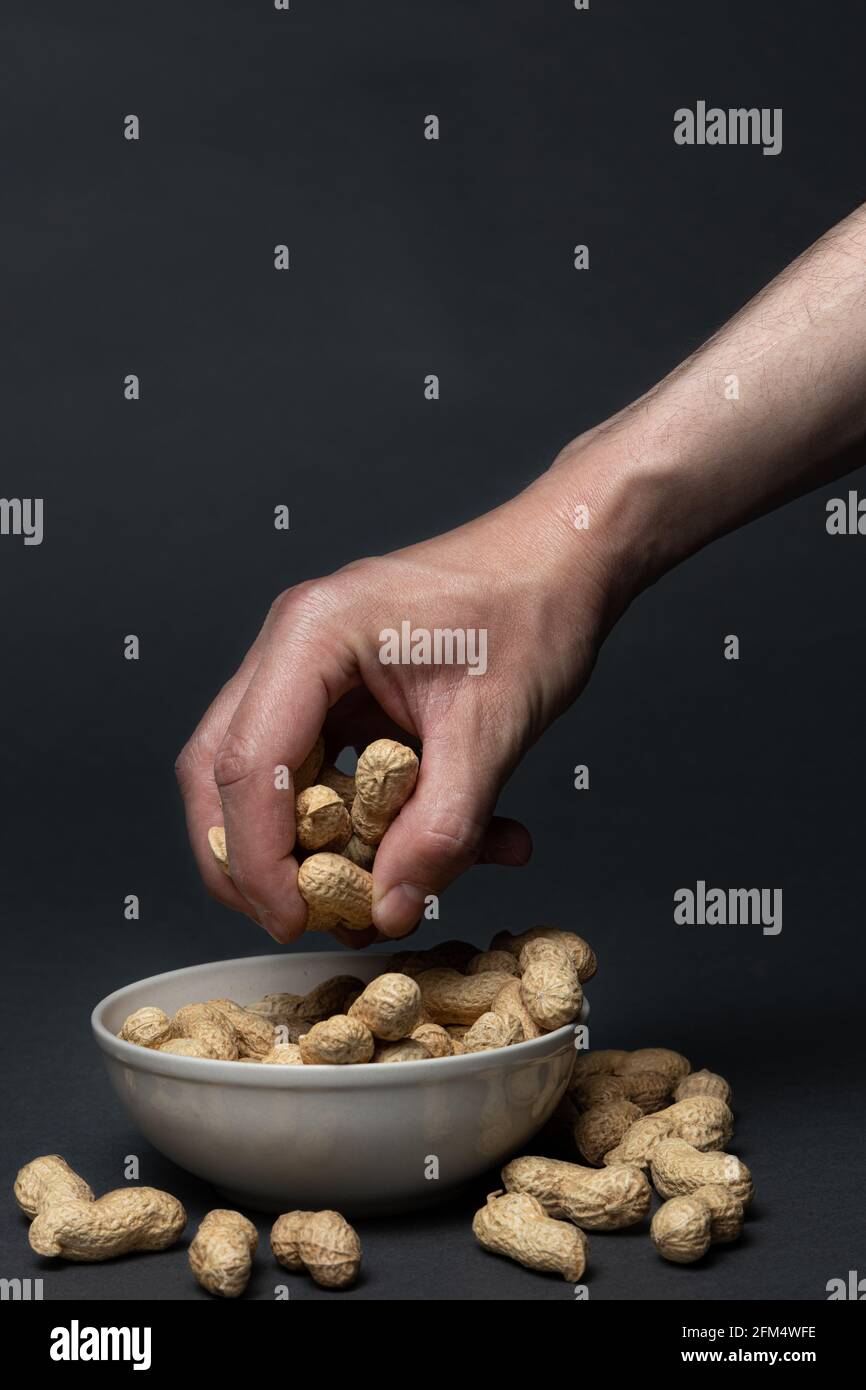 Hand holding nut bowl hi-res stock photography and images - Alamy