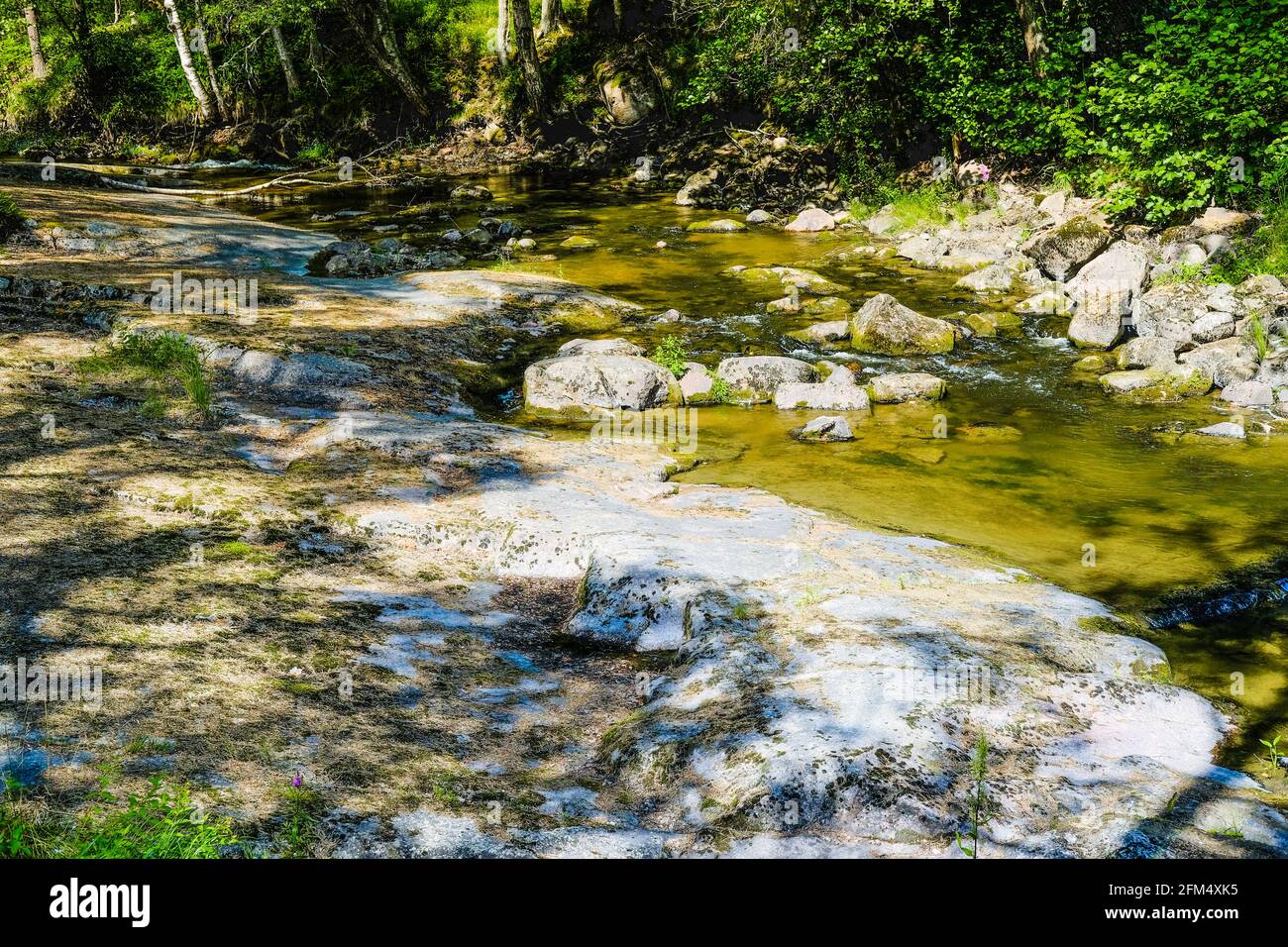Finland, Kotka: Langinkoski rapid on the Kumi river. Fast forest creek ...