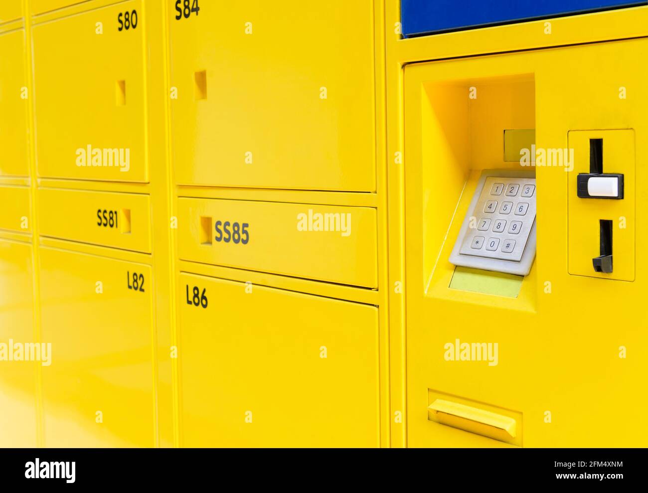Yellow lockers doors with electric code locks Stock Photo - Alamy