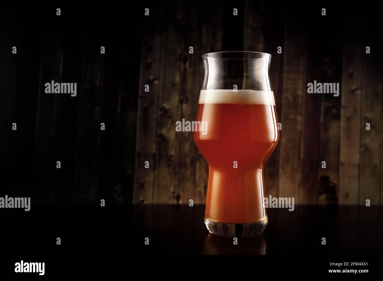 Craft beer glass in the old bar Stock Photo - Alamy