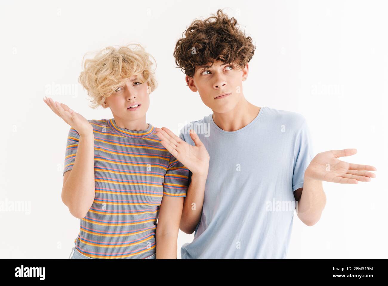 Image of confused woman with her curly brother isolated over white ...