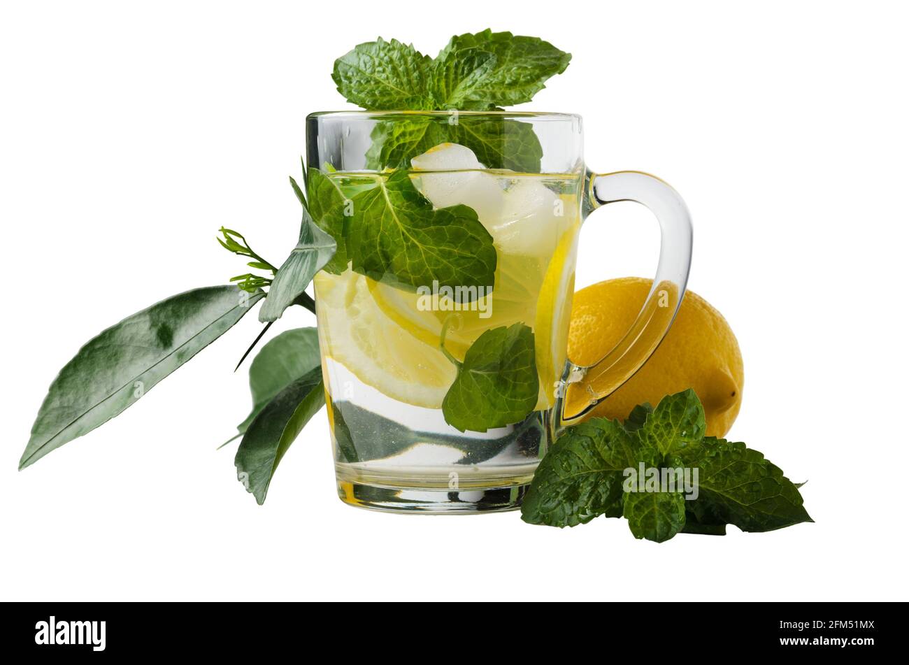 A glass glass of lemonade. Water with lemon slices, mint leaves and ice ...