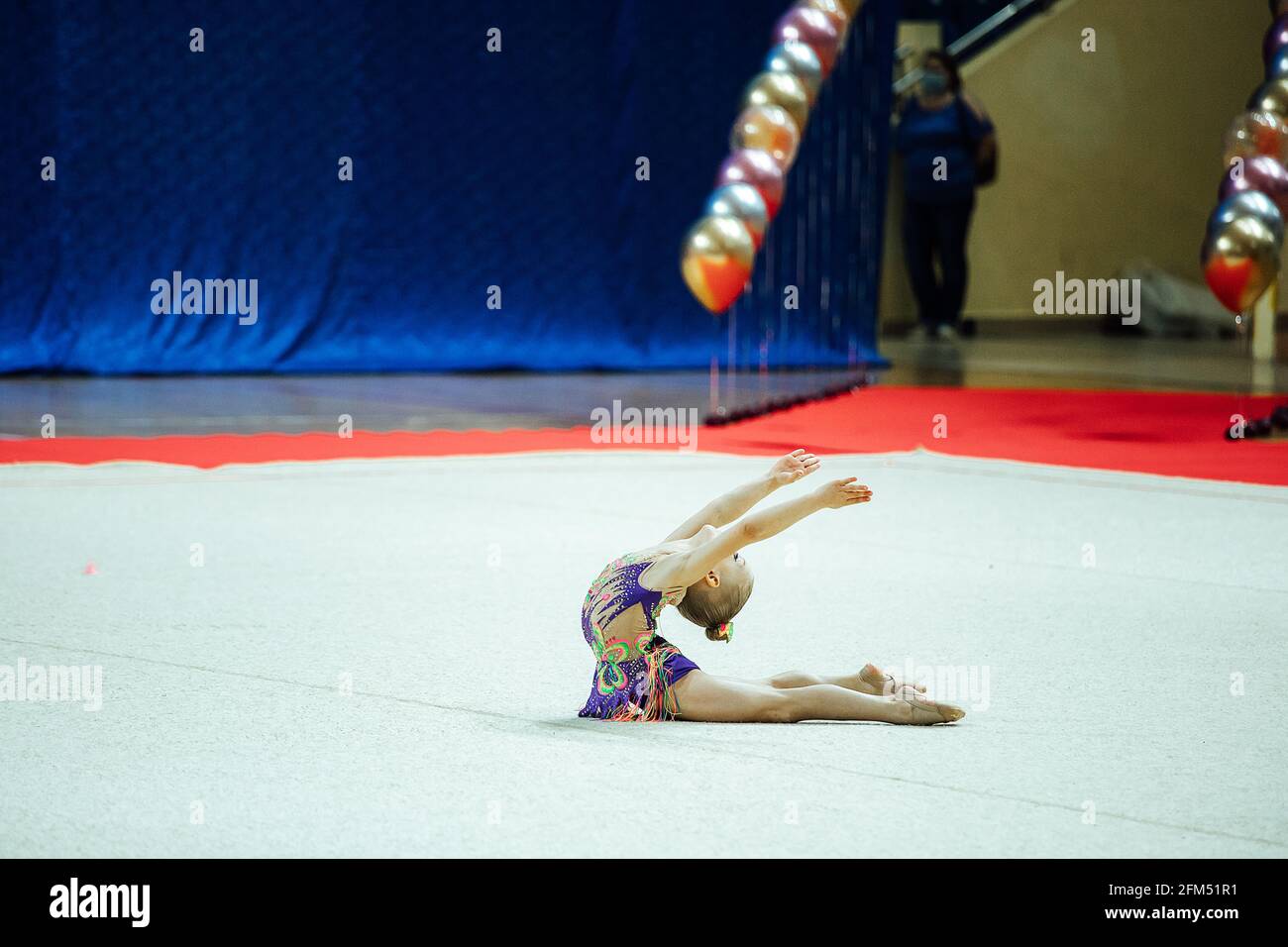 a gymnast girl performs with a hoop. flexible athlete performs a ... a gymnast girl performs with a hoop. flexible athlete performs a ...