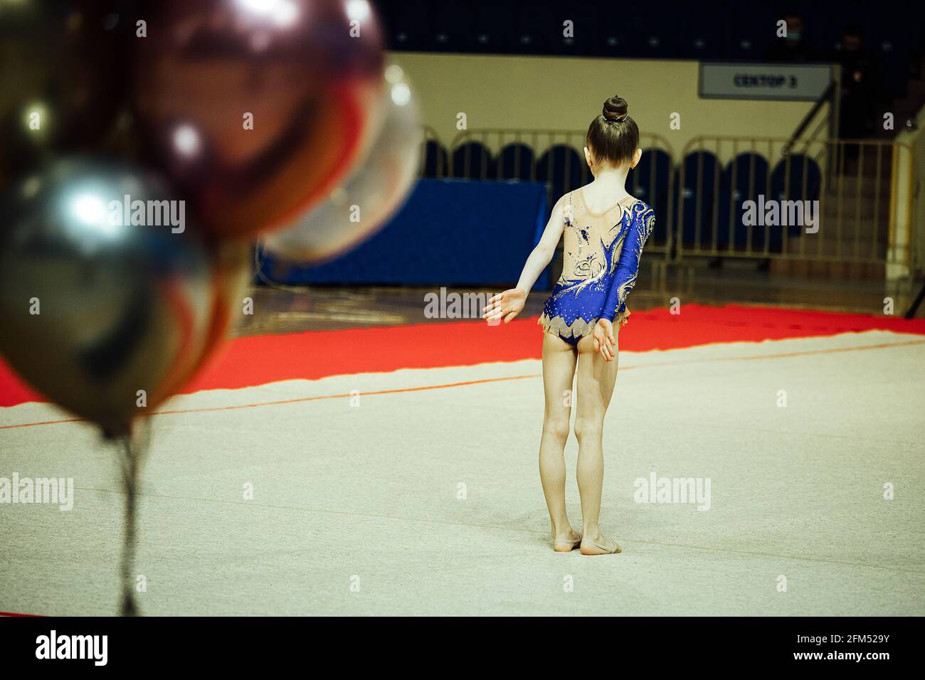 a gymnast girl performs with a hoop. flexible athlete performs a ... a gymnast girl performs with a hoop. flexible athlete performs a ...