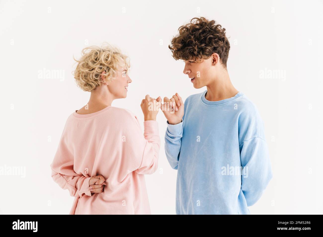 Image of happy woman standing near her brother isolated over white ...