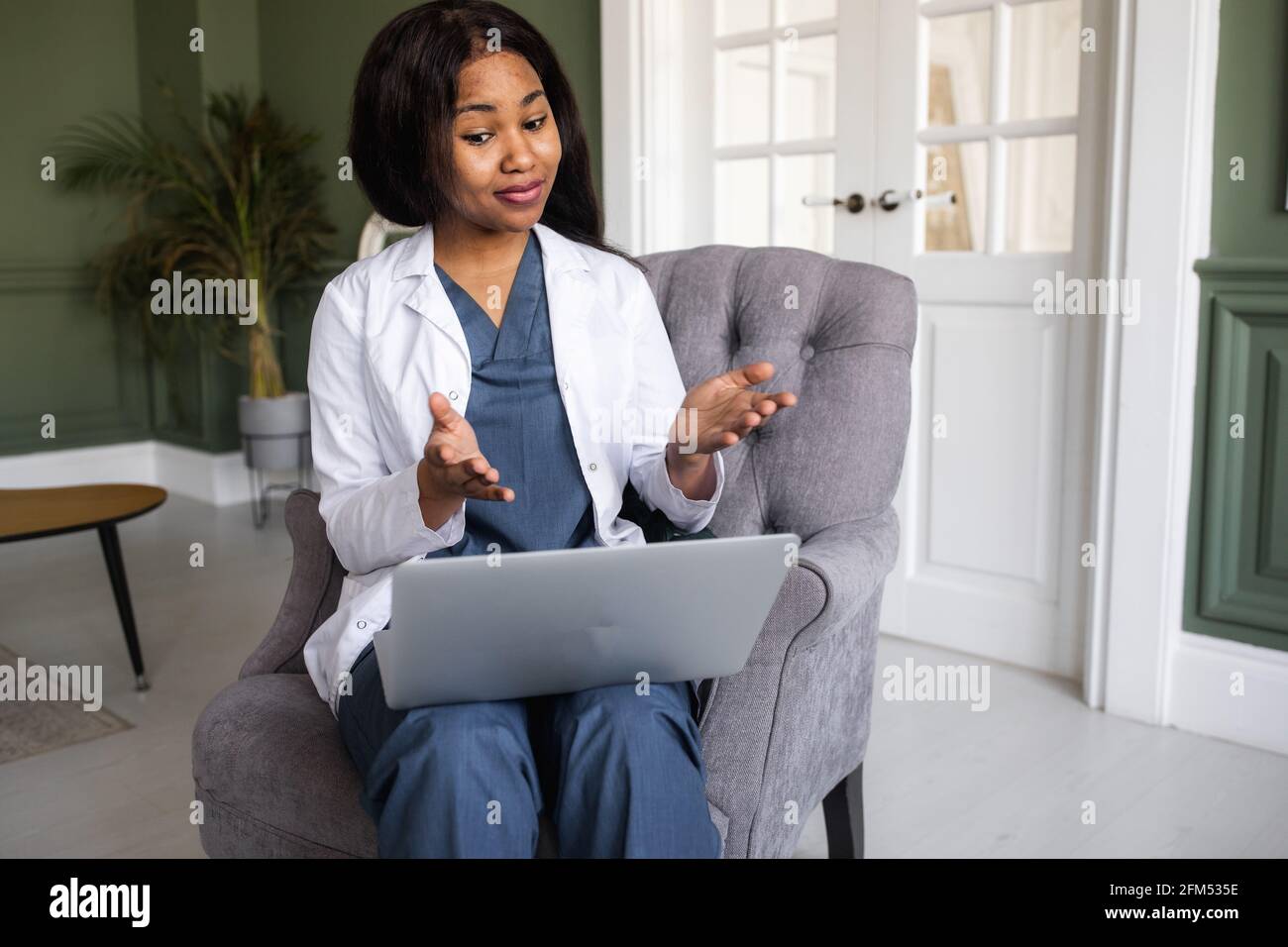 Black doctor. Telemedicine the use of computer and telecommunications ...