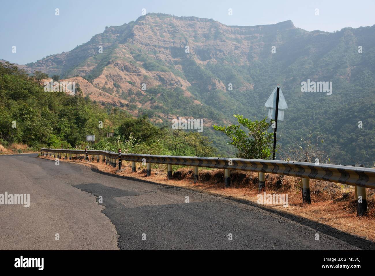 Ghat or Hilly Road surrounded by dense forest, Mahabaleshwar, Konkan ...