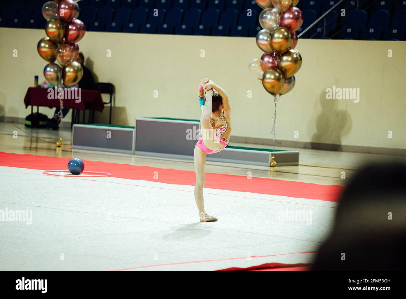 a gymnast girl performs with a hoop. flexible athlete performs a ... a gymnast girl performs with a hoop. flexible athlete performs a ...