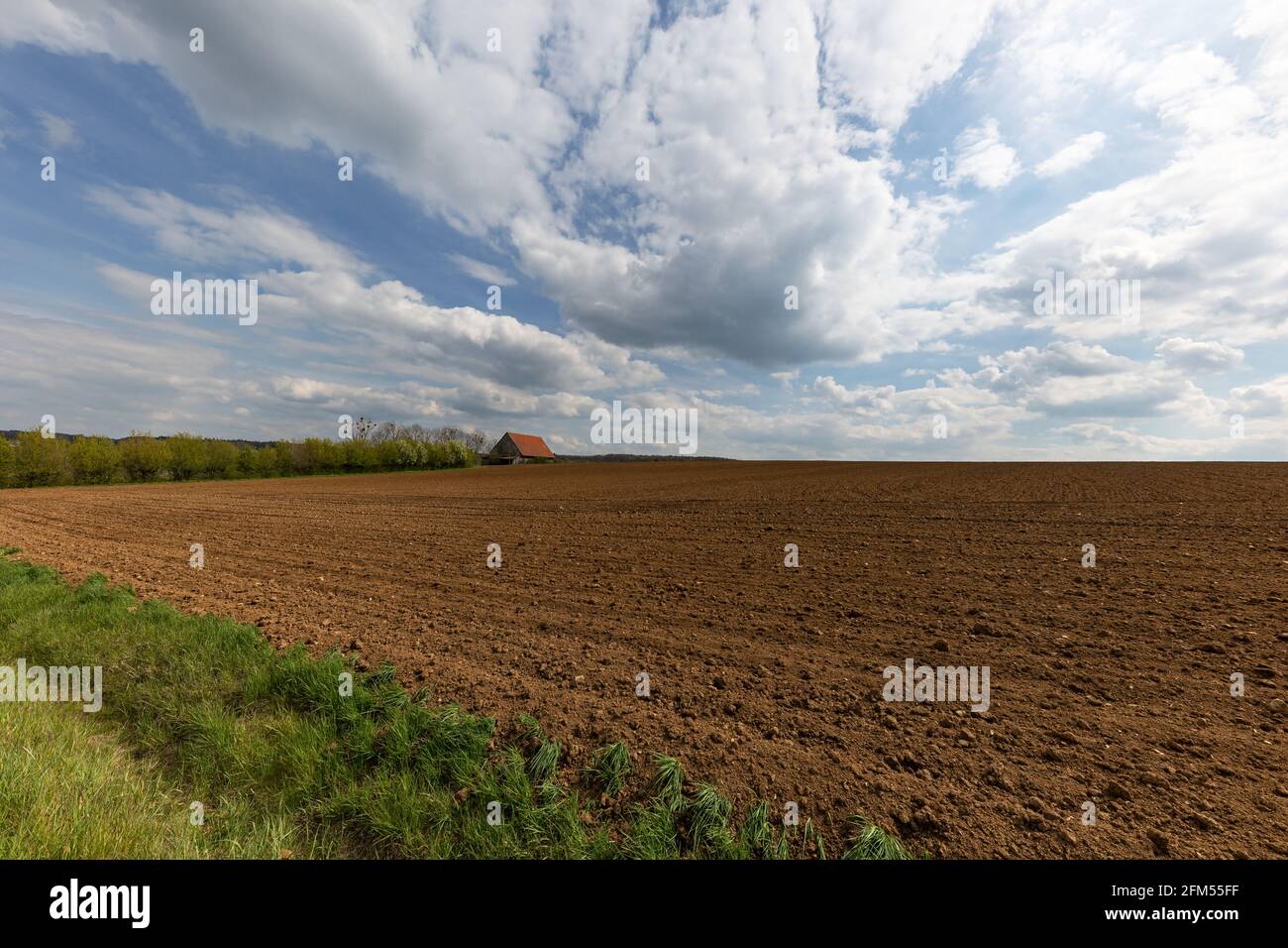 Spring landscape with arable land and meadows Stock Photo - Alamy