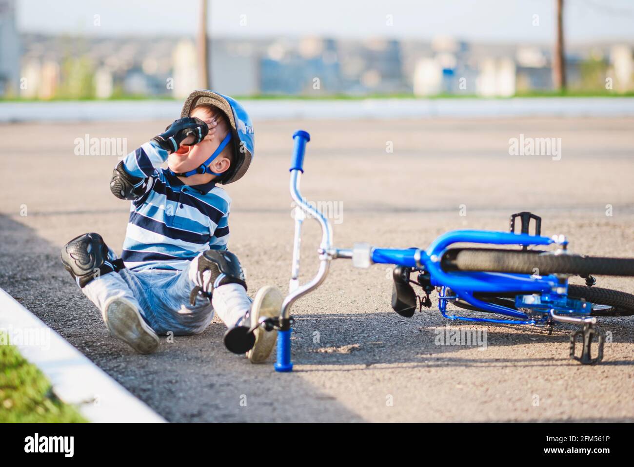 Boy fell of his bike hi-res stock photography and images - Alamy