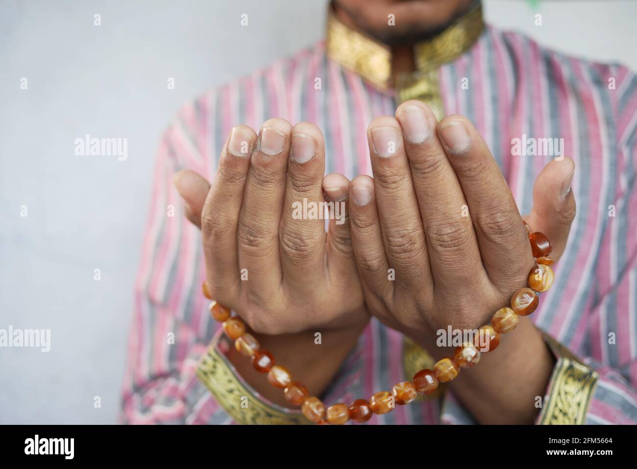 muslim man keep hand in praying gestures during ramadan, Close up Stock ...
