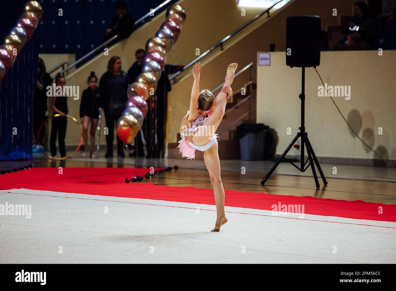a gymnast girl performs with a hoop. flexible athlete performs a ... a gymnast girl performs with a hoop. flexible athlete performs a ...