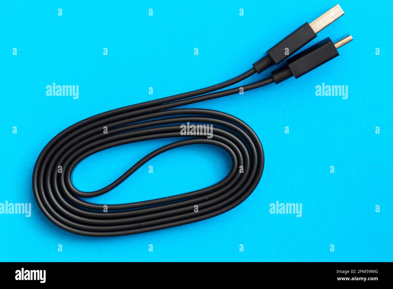 Black USB Type-C cord on blue background for design purpose Stock Photo ...