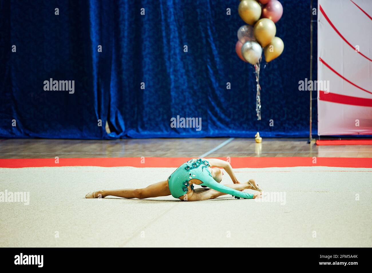 a gymnast girl performs with a hoop. flexible athlete performs a ... a gymnast girl performs with a hoop. flexible athlete performs a ...