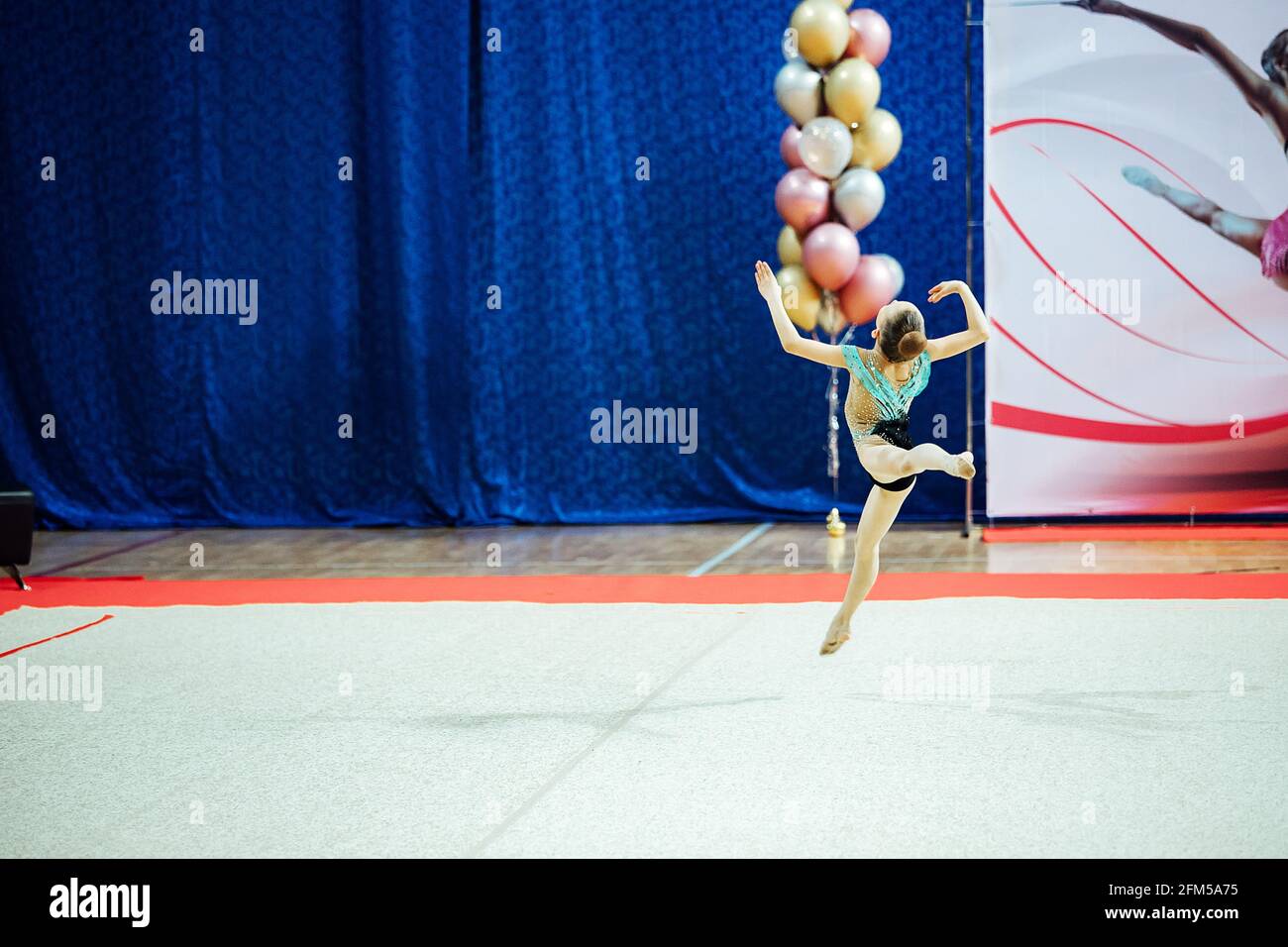 a gymnast girl performs with a hoop. flexible athlete performs a ... a gymnast girl performs with a hoop. flexible athlete performs a ...