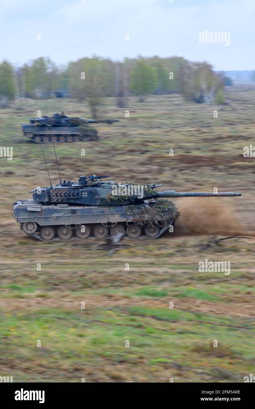 06 May 2021, Saxony-Anhalt, Letzlingen: German Leopard IIA6 tanks from ...