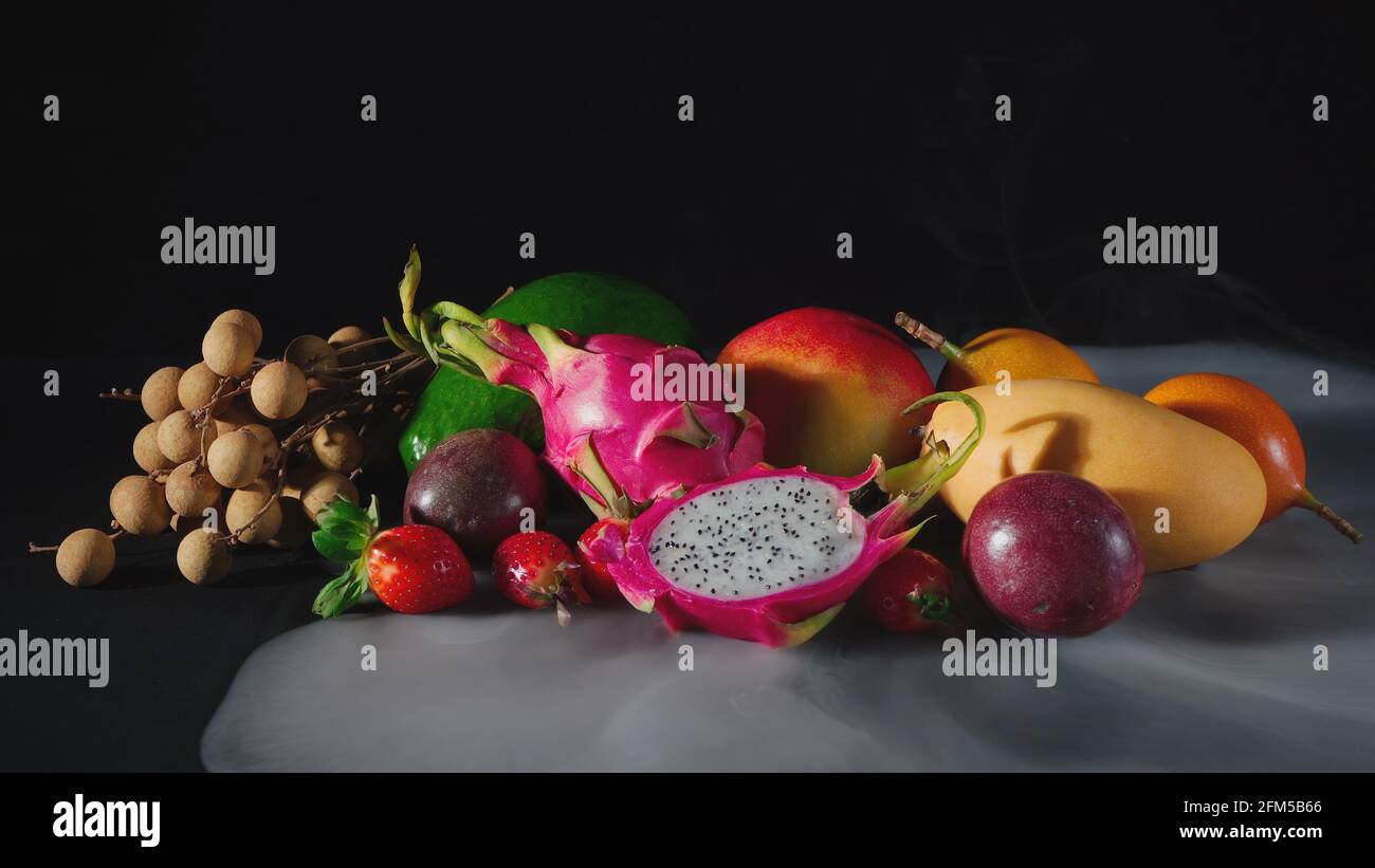 Fresh exotic fruits in the white smoke Stock Photo - Alamy