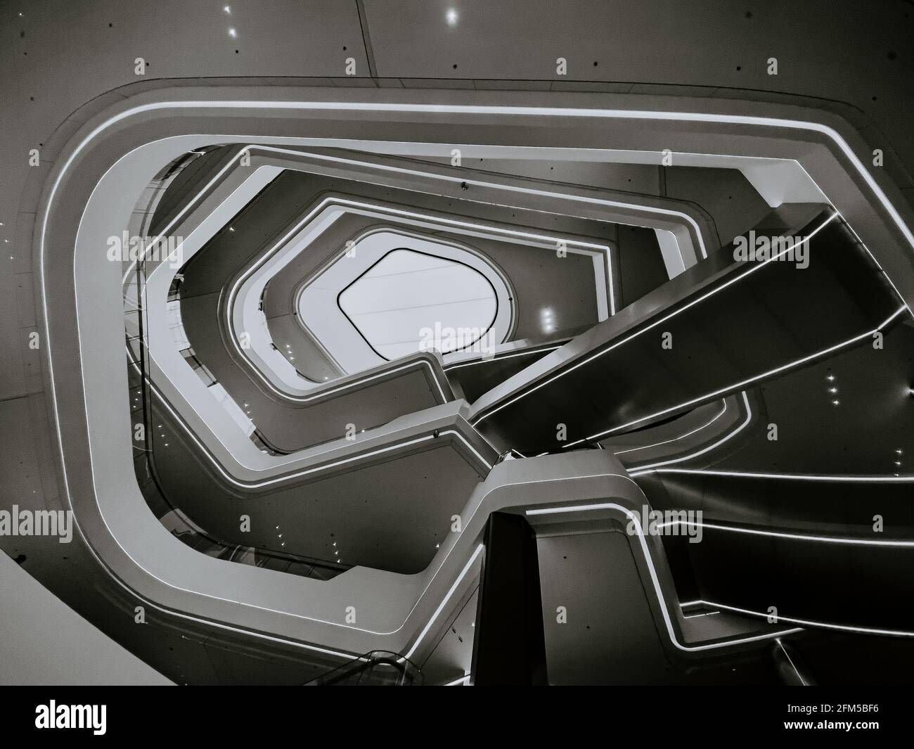 Grayscale shot of square concrete stairway perspective Stock Photo - Alamy