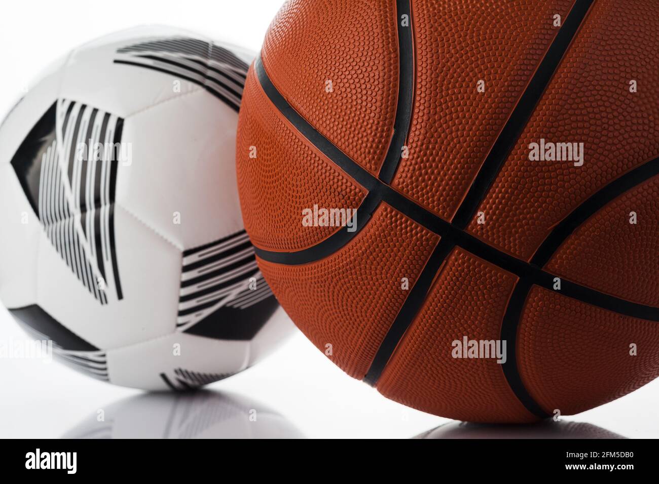 Football and basketball ball on a white background Stock Photo - Alamy