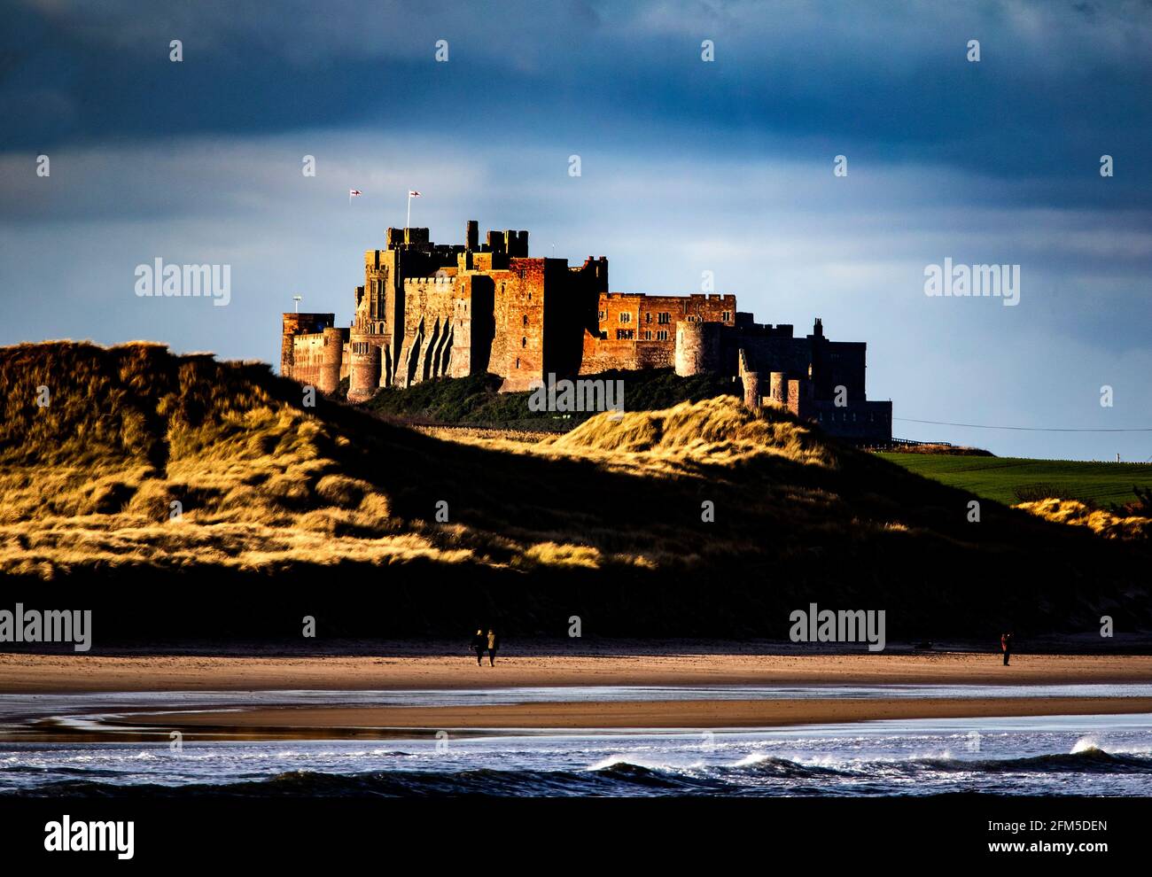 Bamburgh Castle from the harbor at Seahouses Stock Photo - Alamy