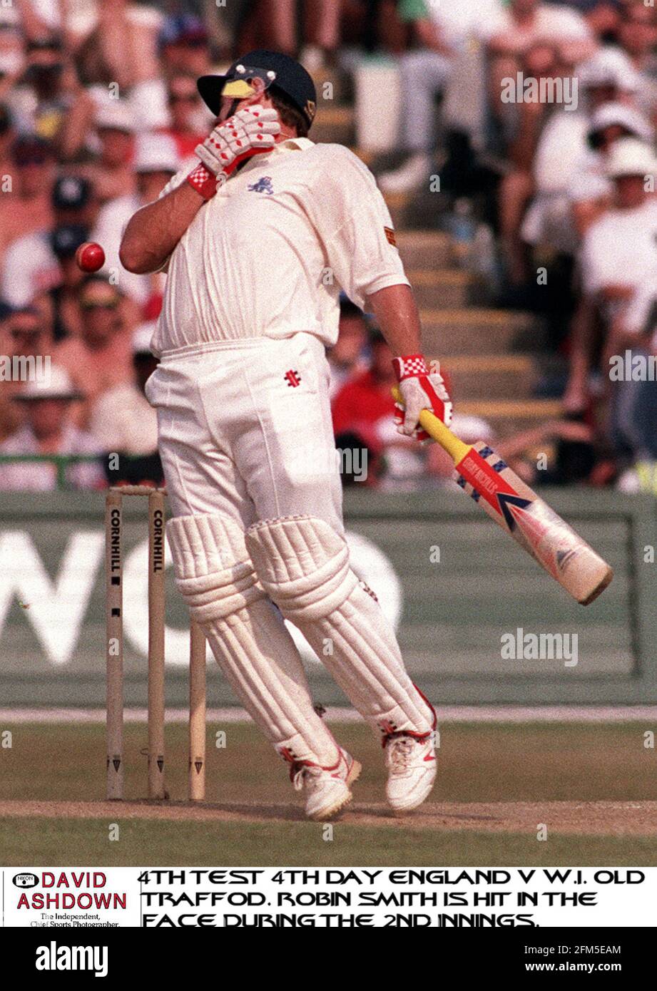 Robin Smith is hit in the face by a 90 mph delivery from Ian Bishop ...