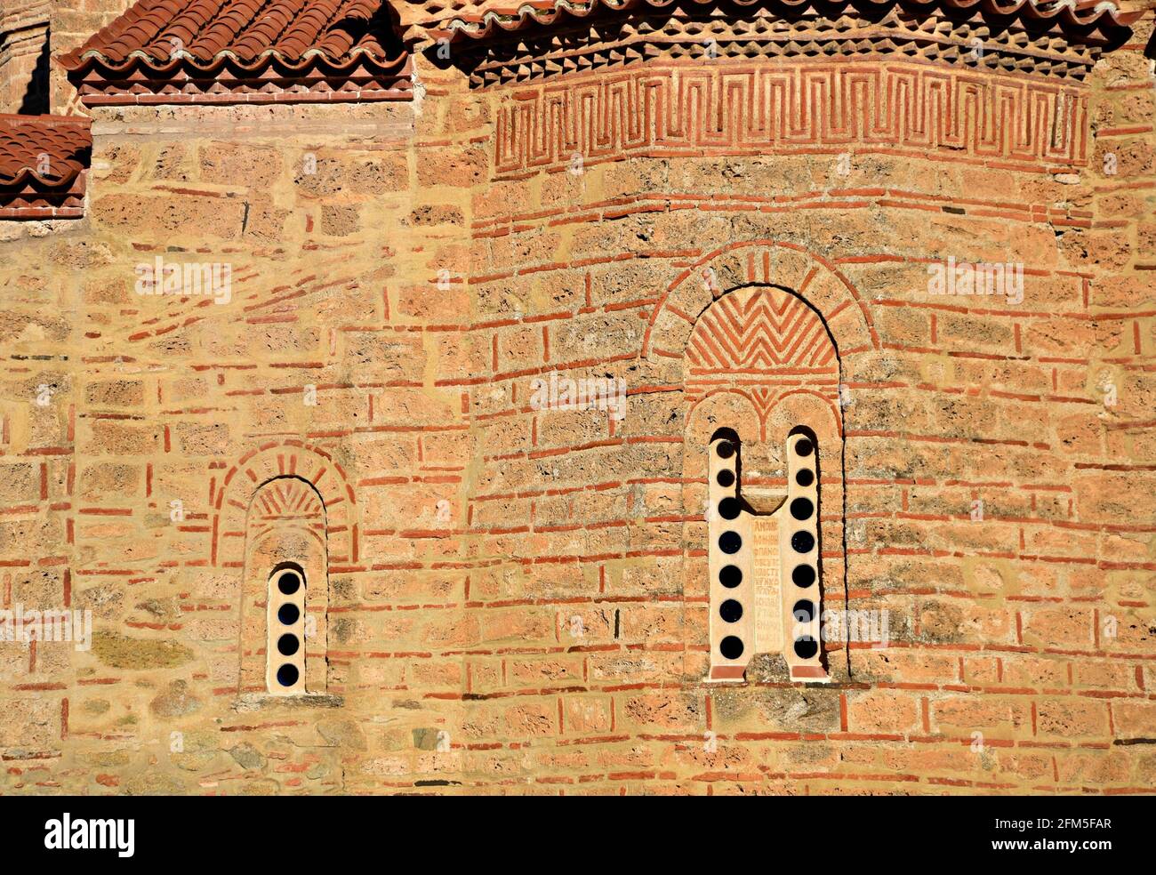 Byzantine church handcrafted red clay tile and stone exterior wall of ...