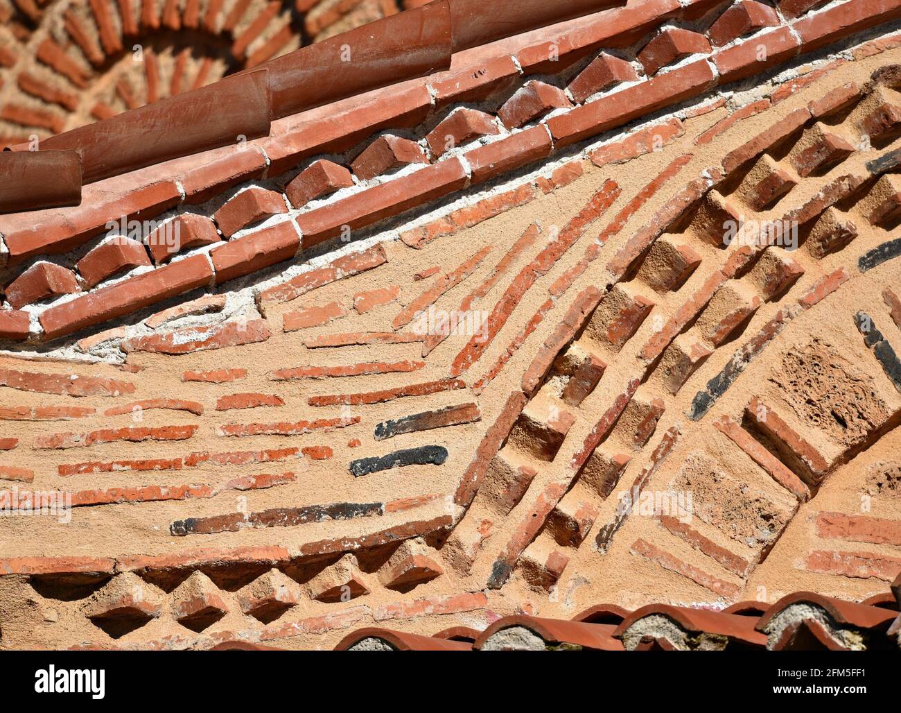 Byzantine church handcrafted red clay tile and stone exterior wall of ...
