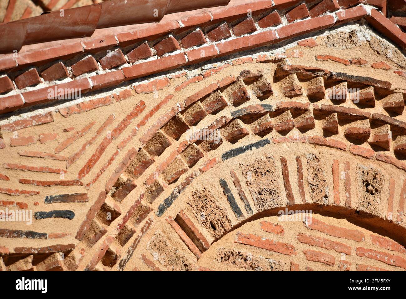 Byzantine church handcrafted red clay tile and stone exterior wall of ...