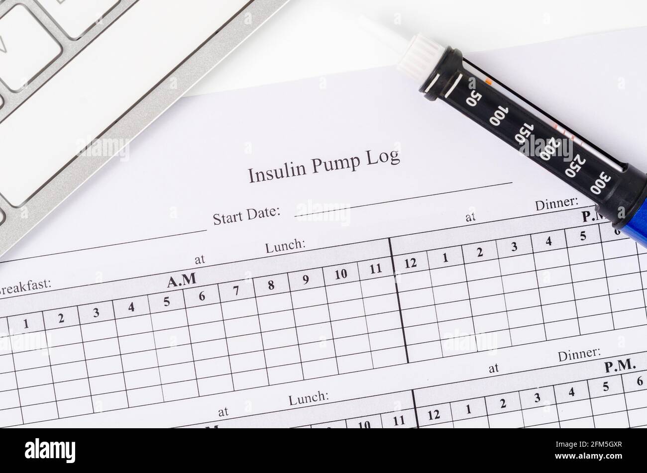 Insulin pump log record form and syringe wiht insulin for patient Stock ...