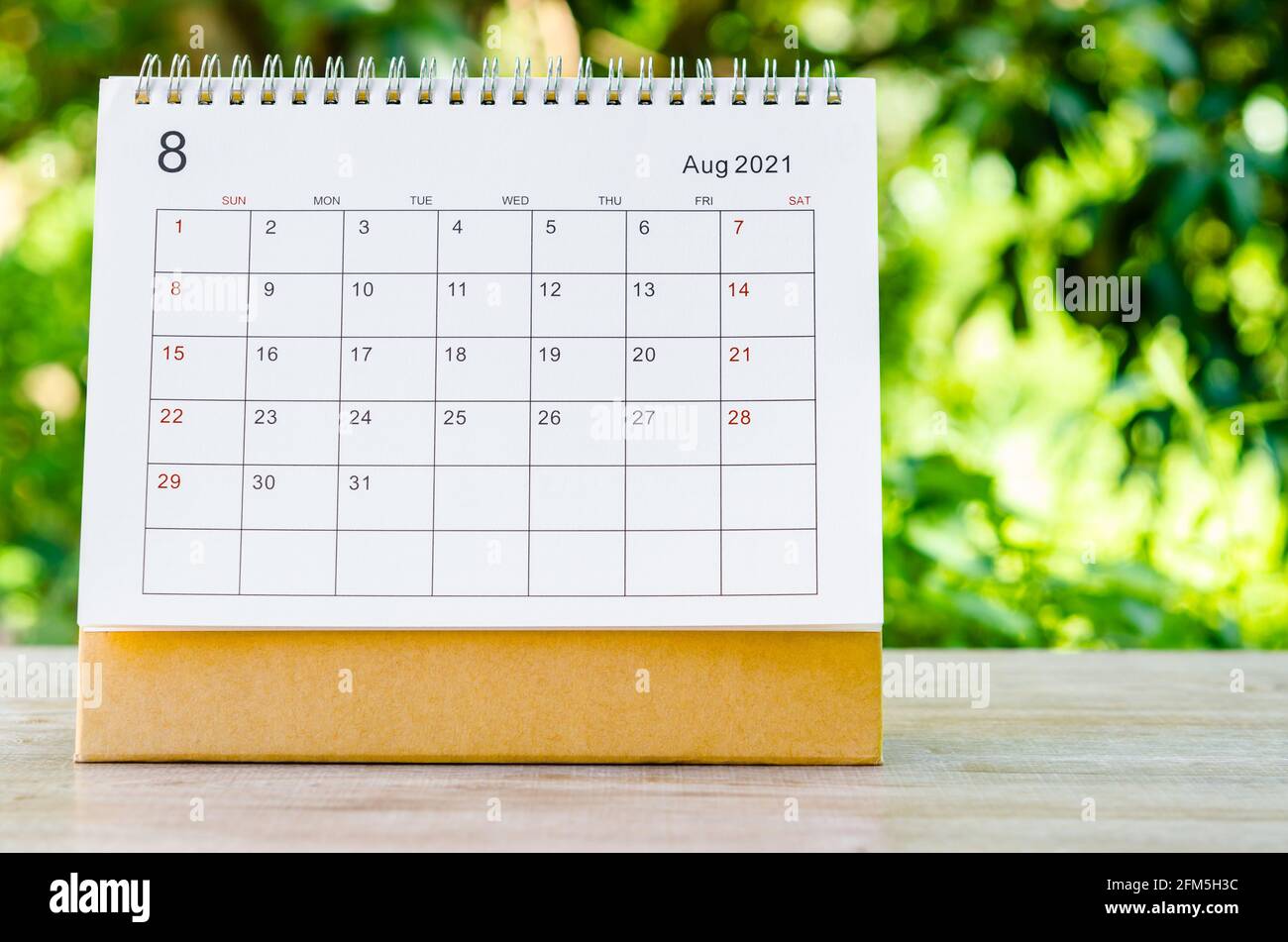 August 2021 Calendar desk for organizer to plan and reminder on wooden ...