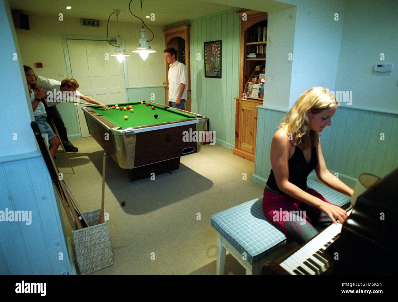 CHILDREN ENJOYING THE GAMES ROOM, AT CLIPPER HOUSE, WEST LOOE Stock ...