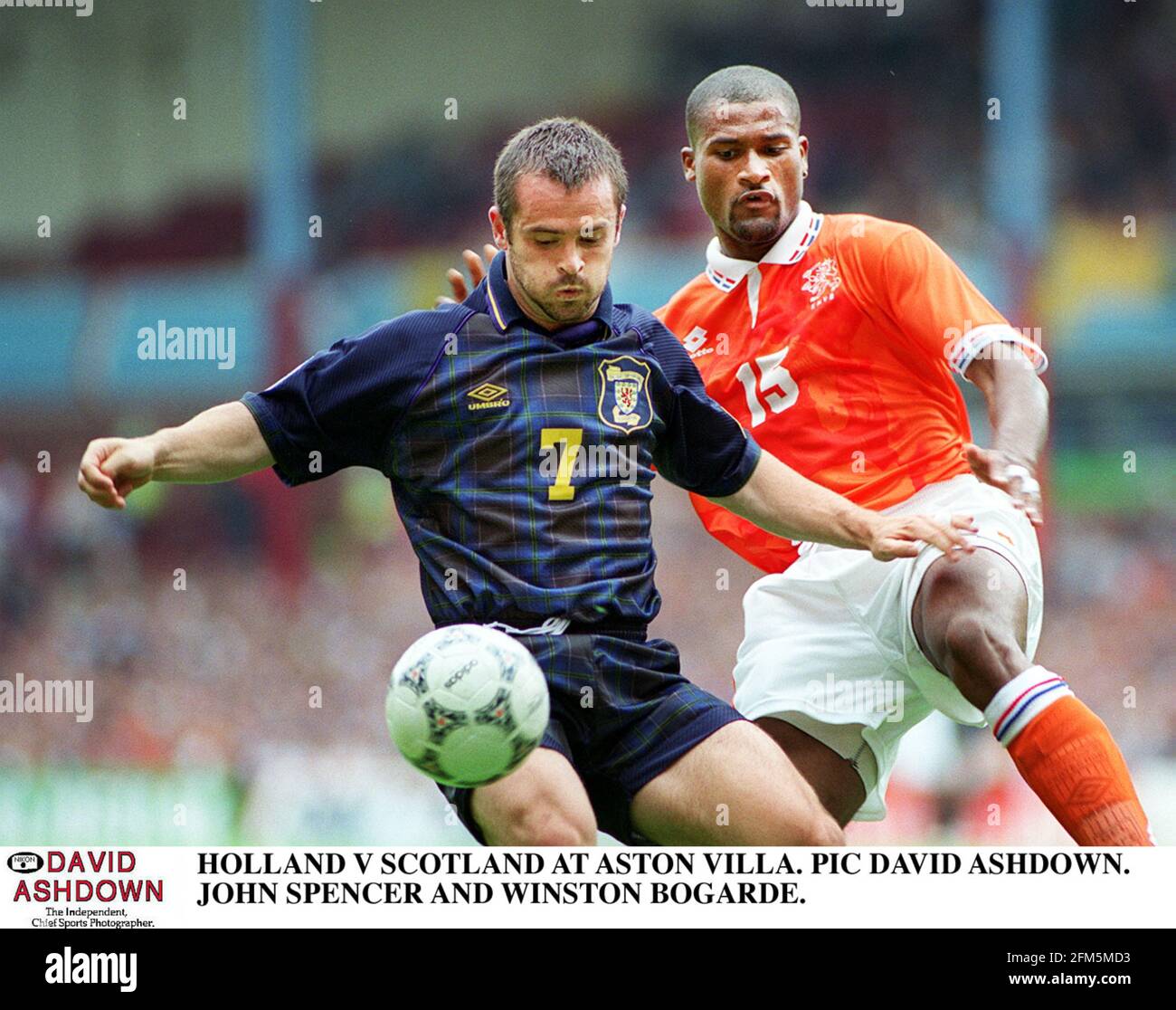 Scotlands John Spencer and Winston Bogarde of Holland during Scotlands ...