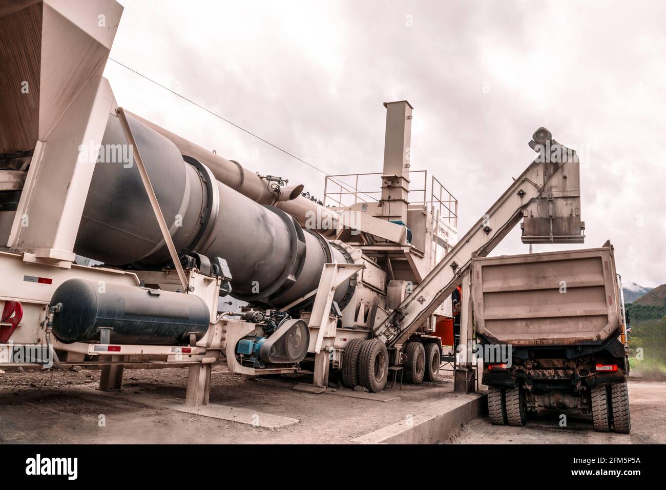 Pitching machine for concrete during work proce Stock Photo - Alamy