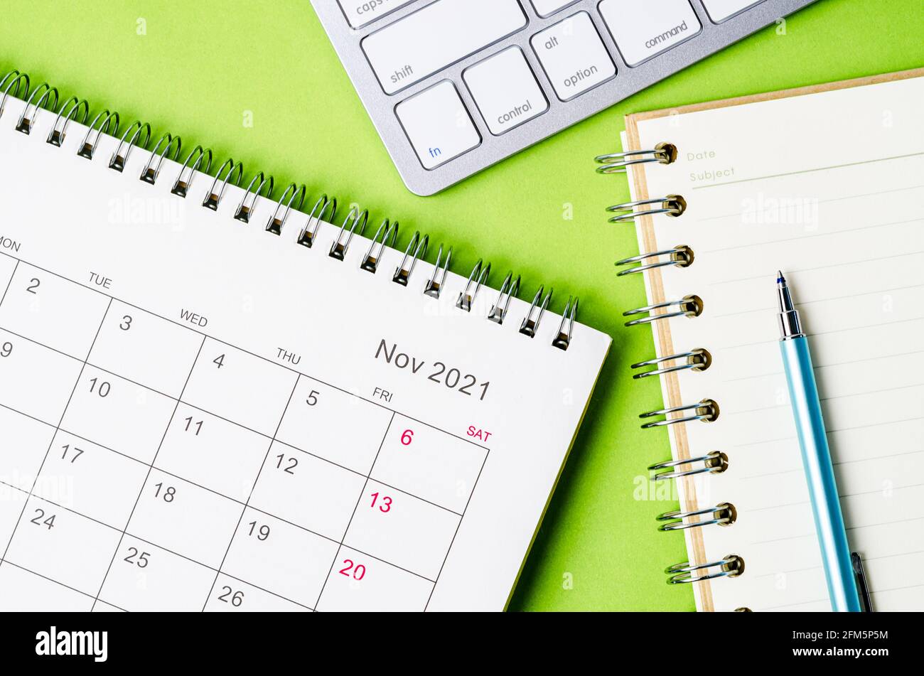November 2021 calendar with note book on green color background Stock ...