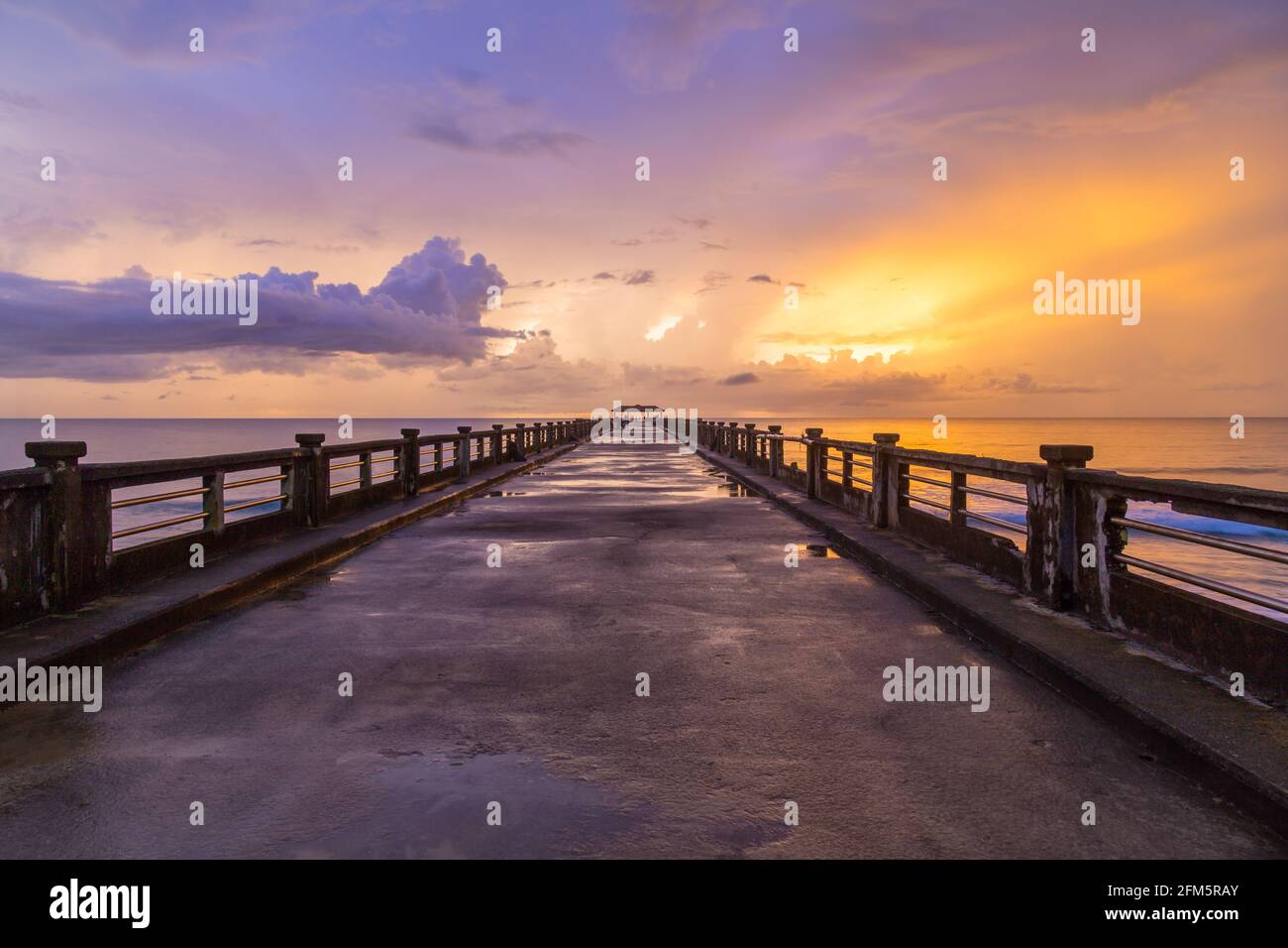 Bridge on beach in sunset and sea wave at Thailand Stock Photo - Alamy