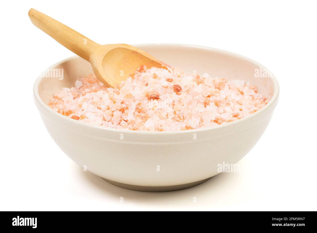 Red coarse Himalayan salt in a bowl with wooden shovel isolated on ...