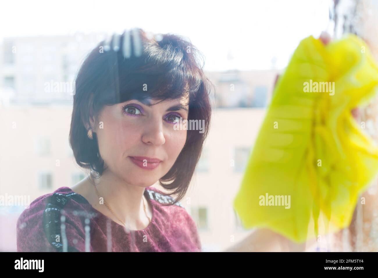 Woman washing windows hi-res stock photography and images - Alamy