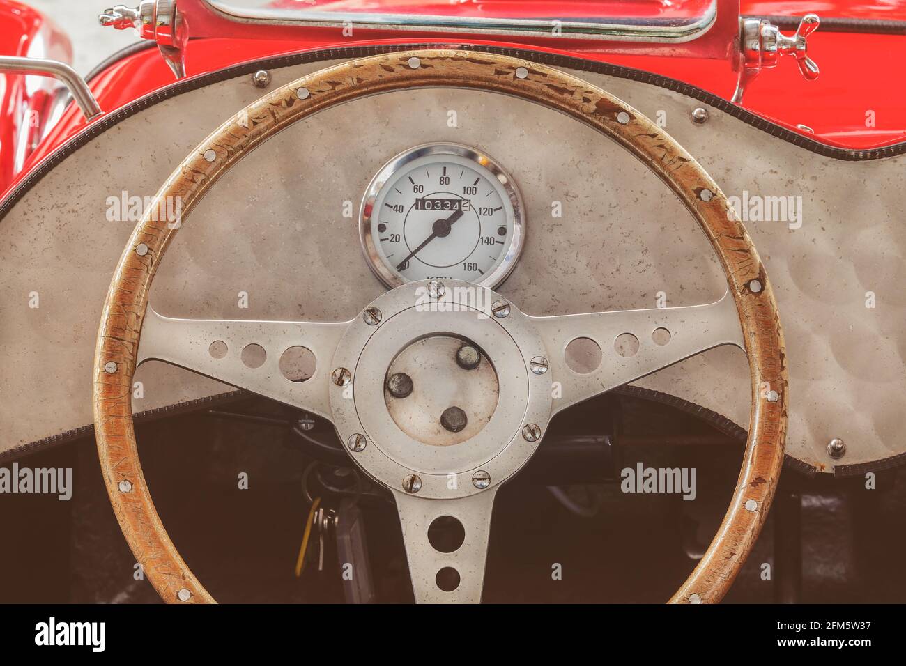 Retro styled image of the interior of a classic red kit car convertible ...