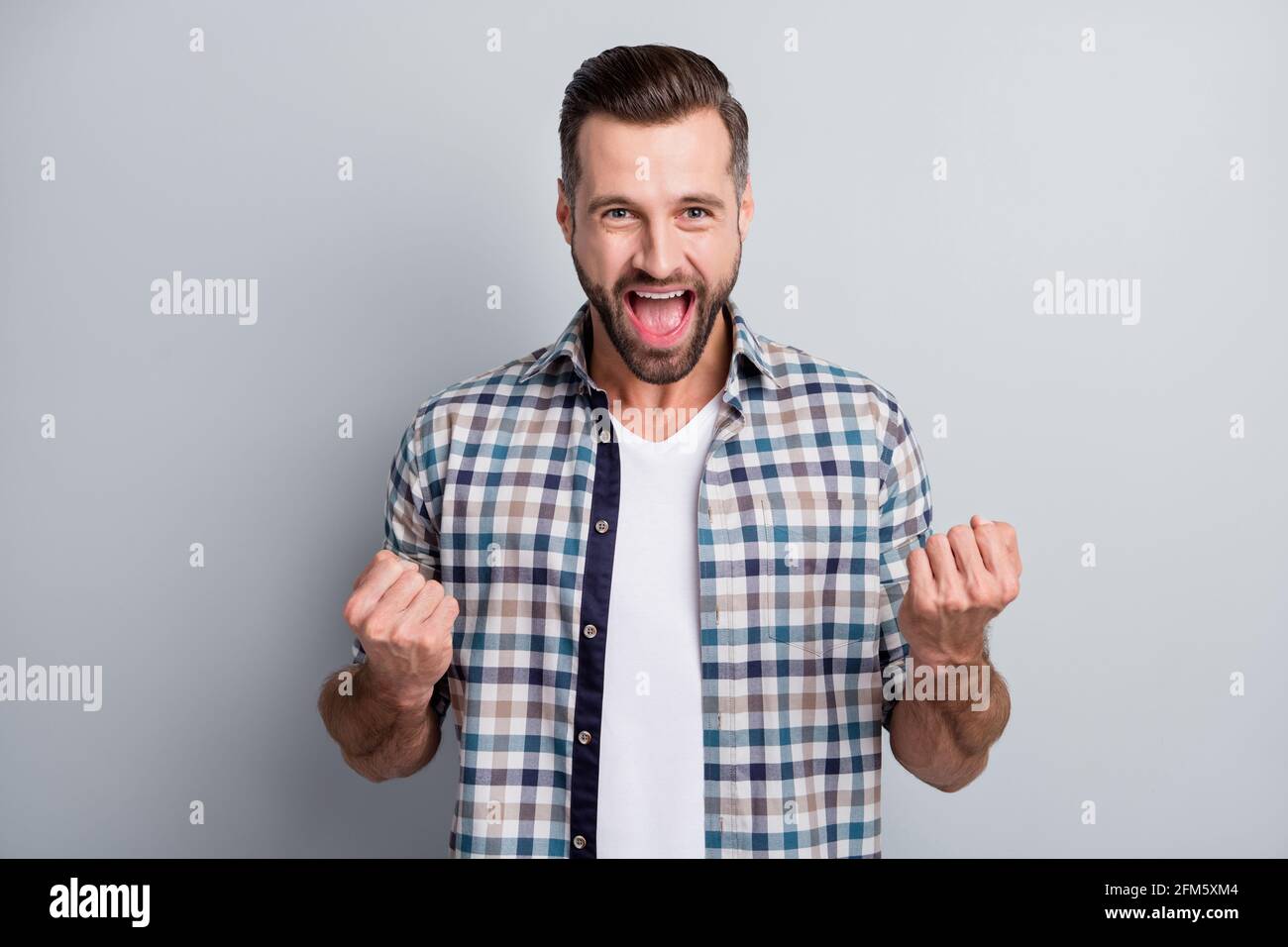 Photo portrait of impressed businessman gesturing like winner cheerful ...
