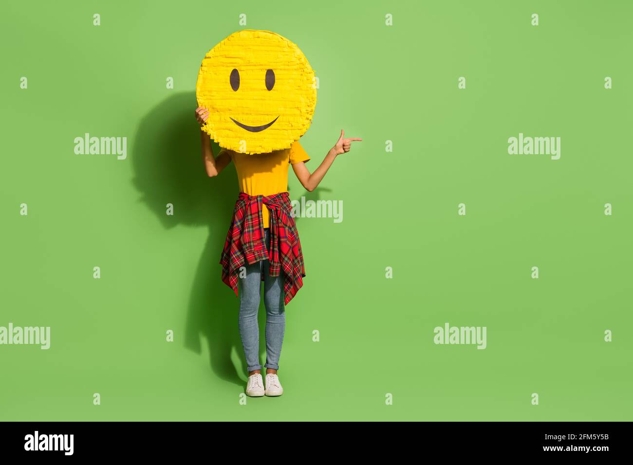 Photo of charming funny dark skin lady dressed t-shirt hiding smiley ...