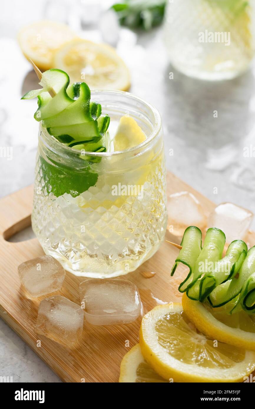 Refreshing iced drink with lemon and cucumber Stock Photo - Alamy