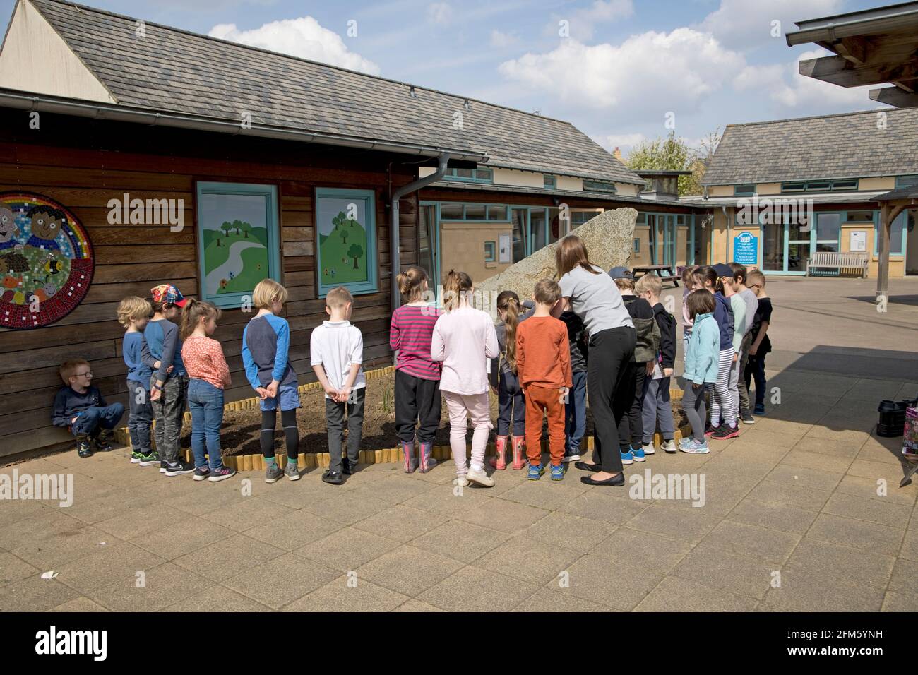 Primary school children planting wild flower seeds Mickleton School UK ...