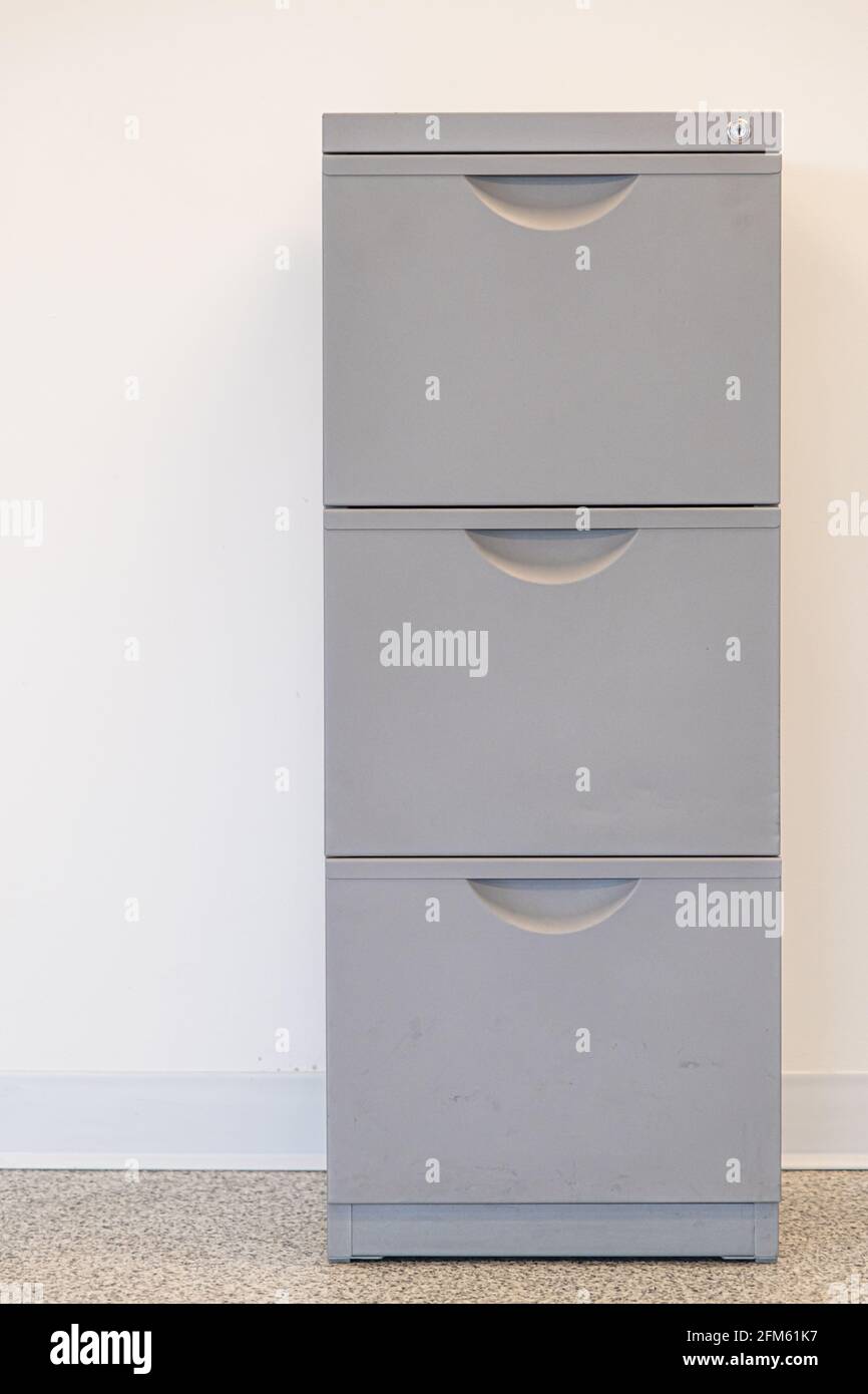 3 drawer filing cabinet in Office for keeping records Stock Photo - Alamy